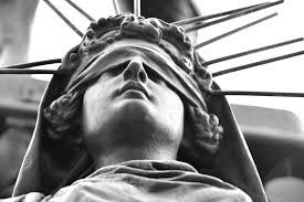 Why Lady Justice Must Not Come Down for Tea